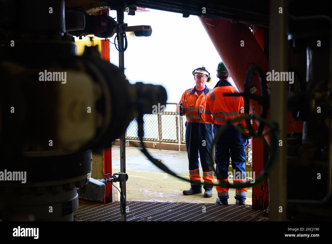 Members of the Centrica crew walk along a gangway on the the Rough 47 ...