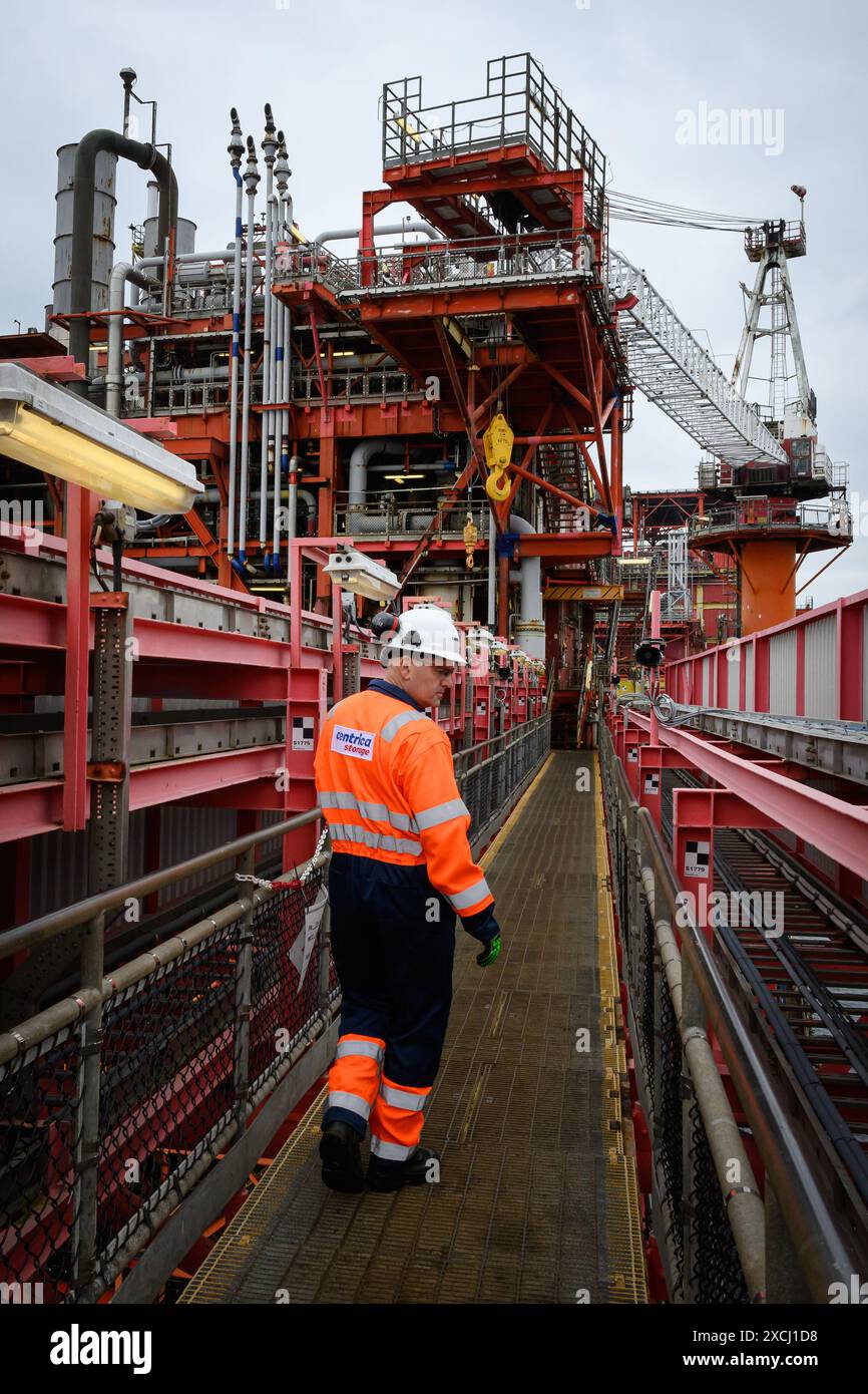 A member of the Centrica crew walks along a gangway on the the Rough 47 ...