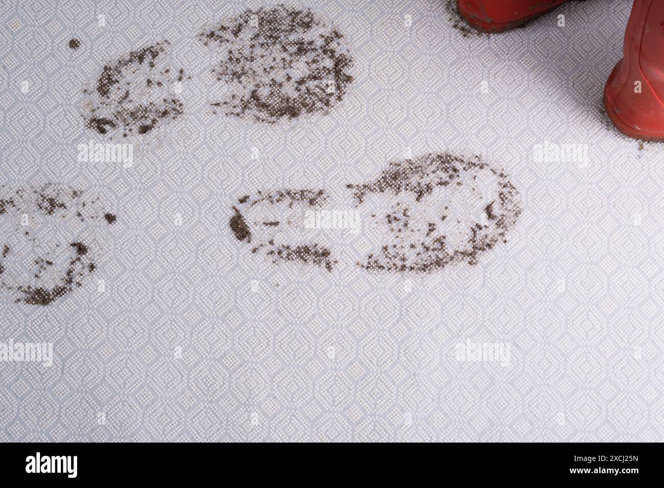 Muddy carpet. Dirty footprints in wet mud, red shoes isolated on ...