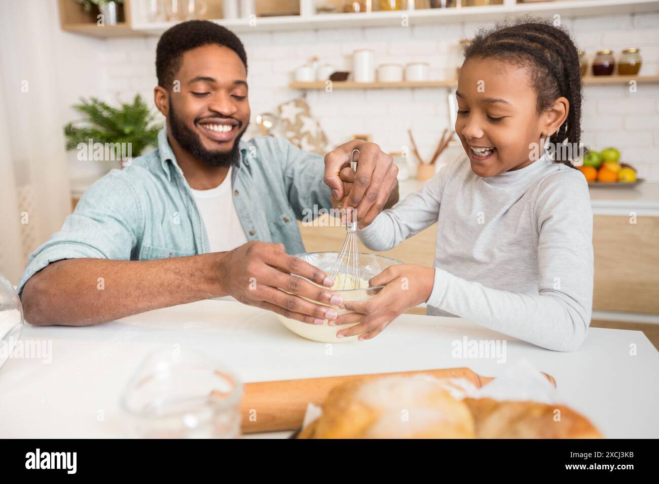 Father teaching daughter how to make dough Stock Photo - Alamy