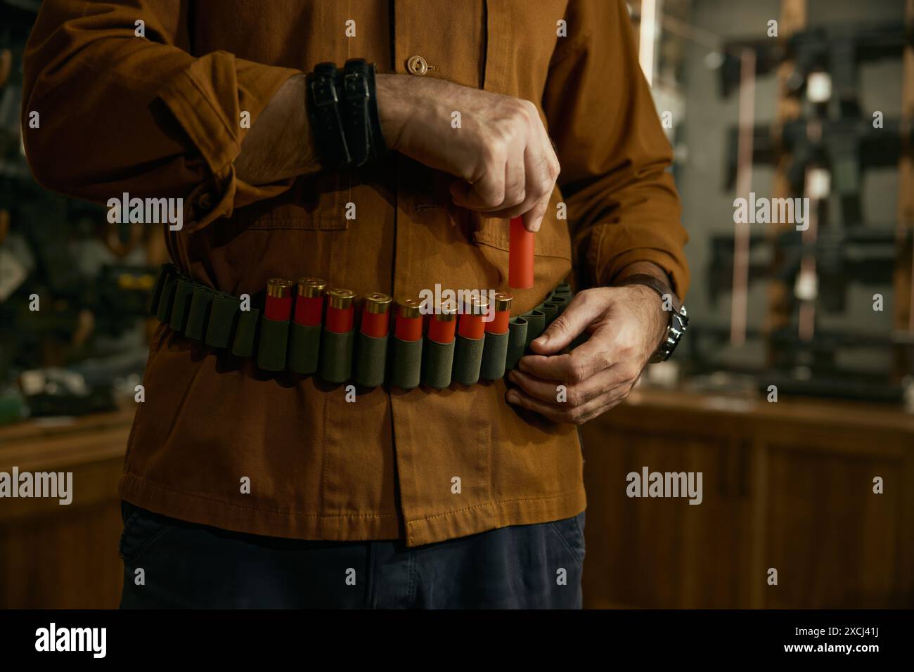 Closeup of hunter hands placing bullets into the ammo belt Stock Photo ...