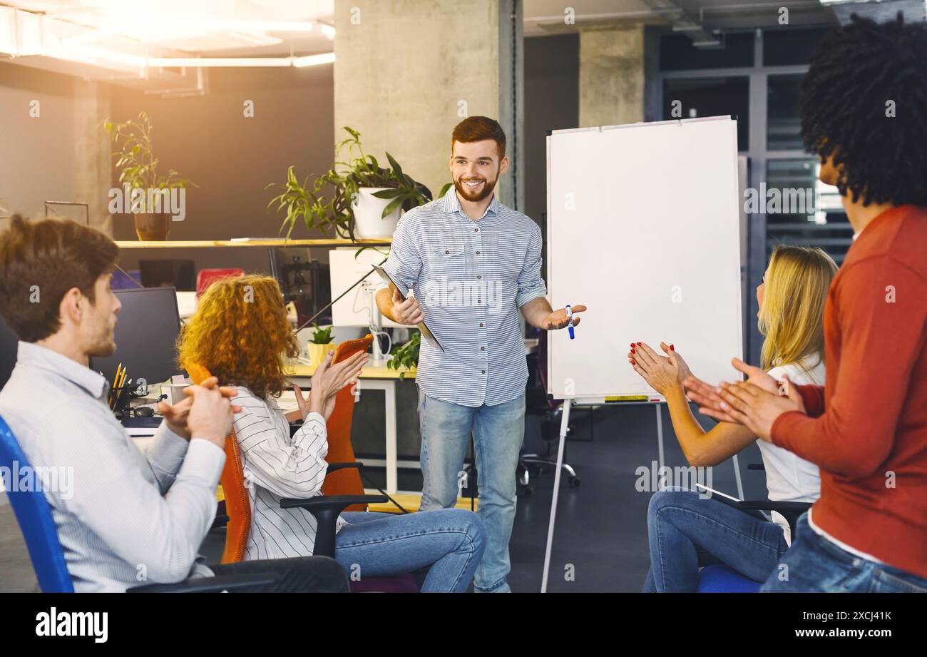Man Giving Presentation to Group of People Stock Photo - Alamy