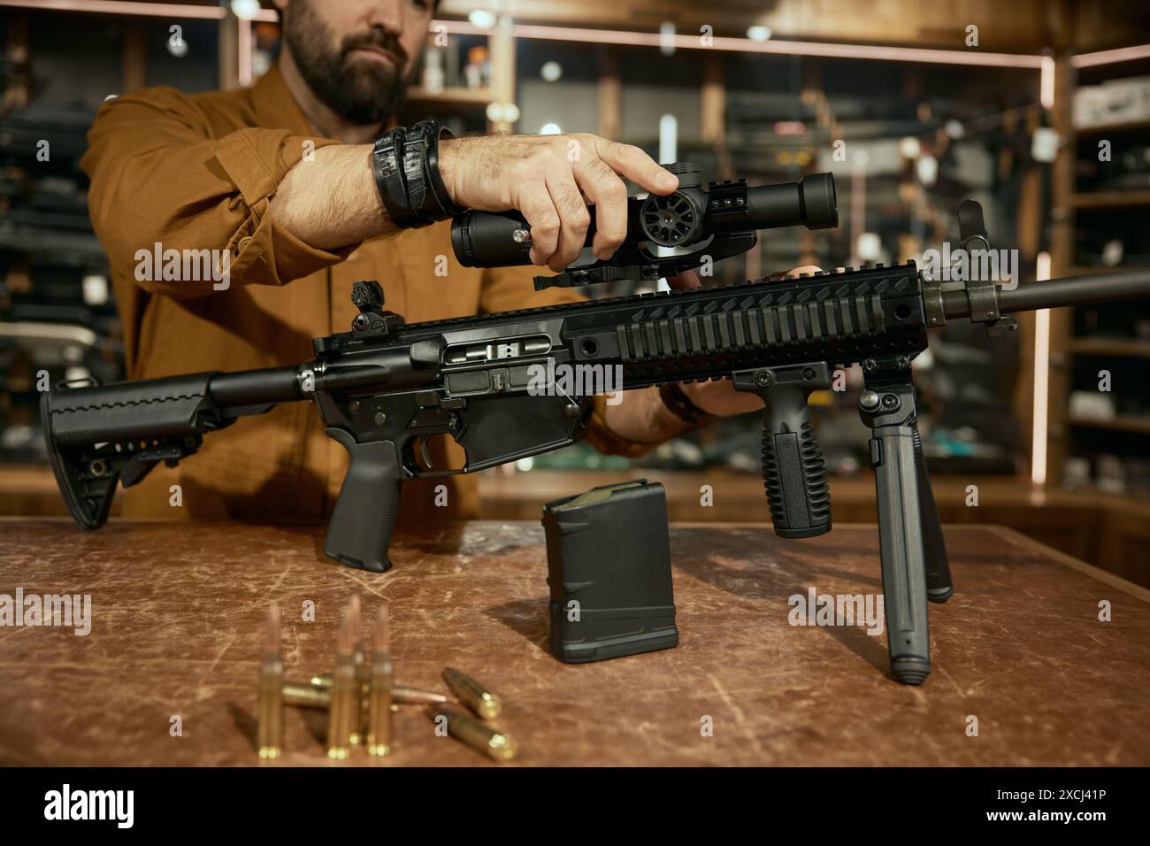 Salesman in process of tactical firearms assembly, quality guns ...