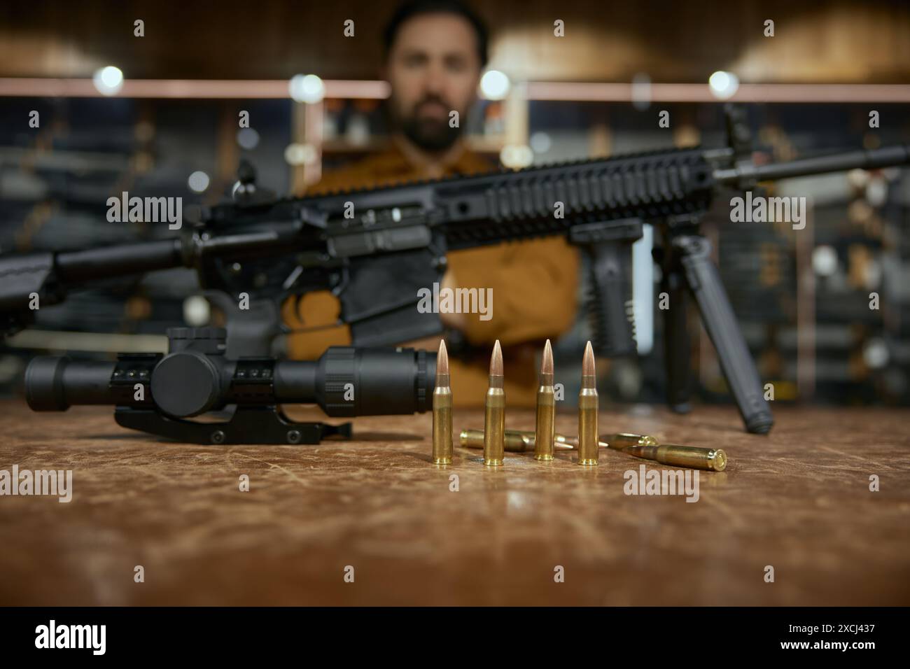 Closeup automatic rifle and bullets at weapon store Stock Photo - Alamy