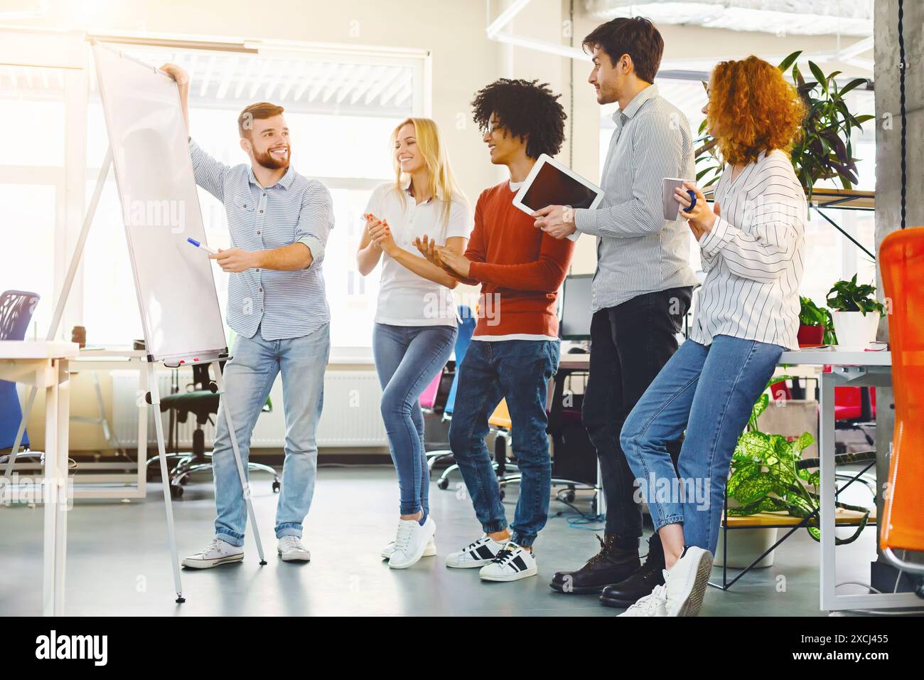 Group of People Around Whiteboard, Have Briefing Stock Photo - Alamy