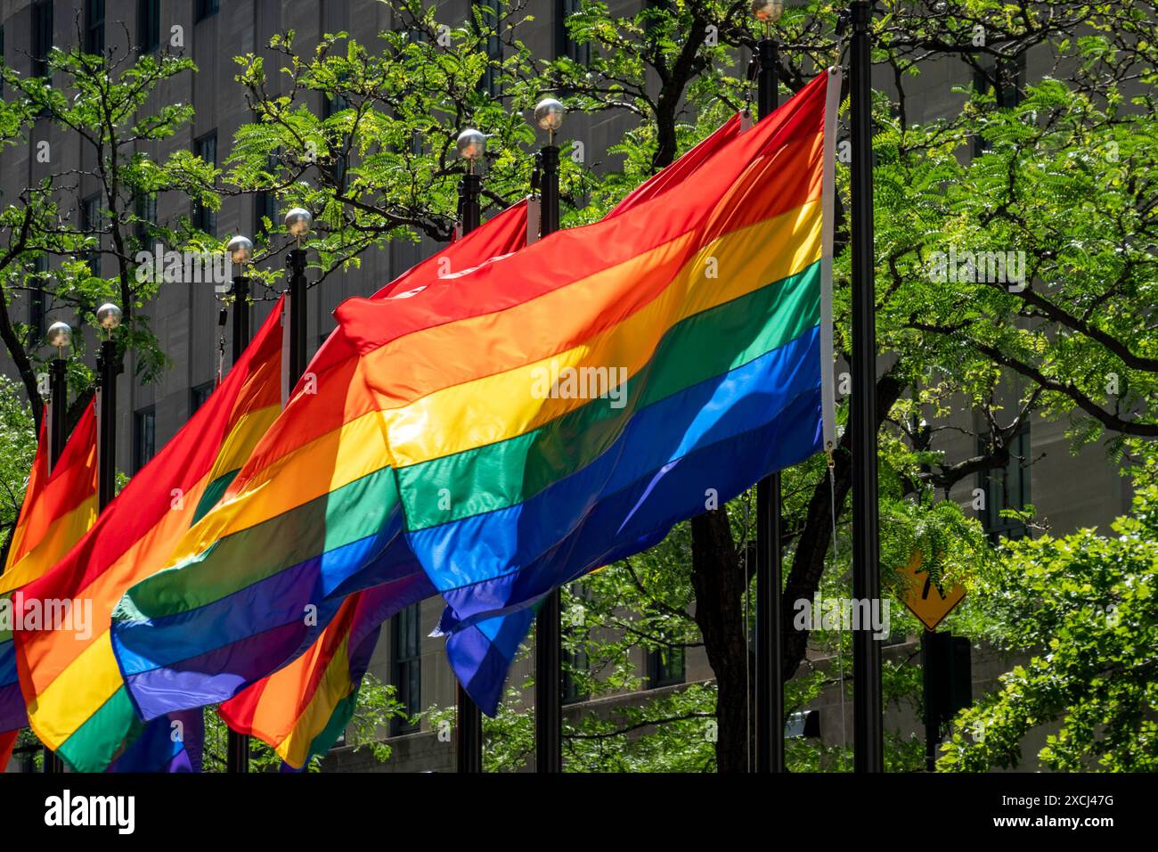 Pride month flags surround the plaza in Rockefeller Center, New York ...