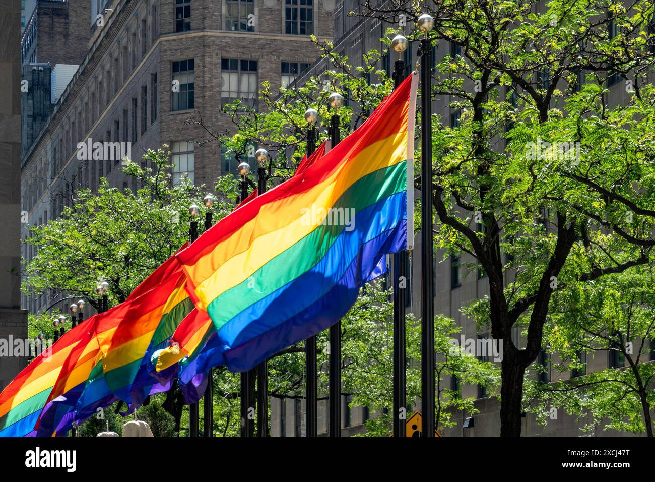 Pride month flags surround the plaza in Rockefeller Center, New York ...
