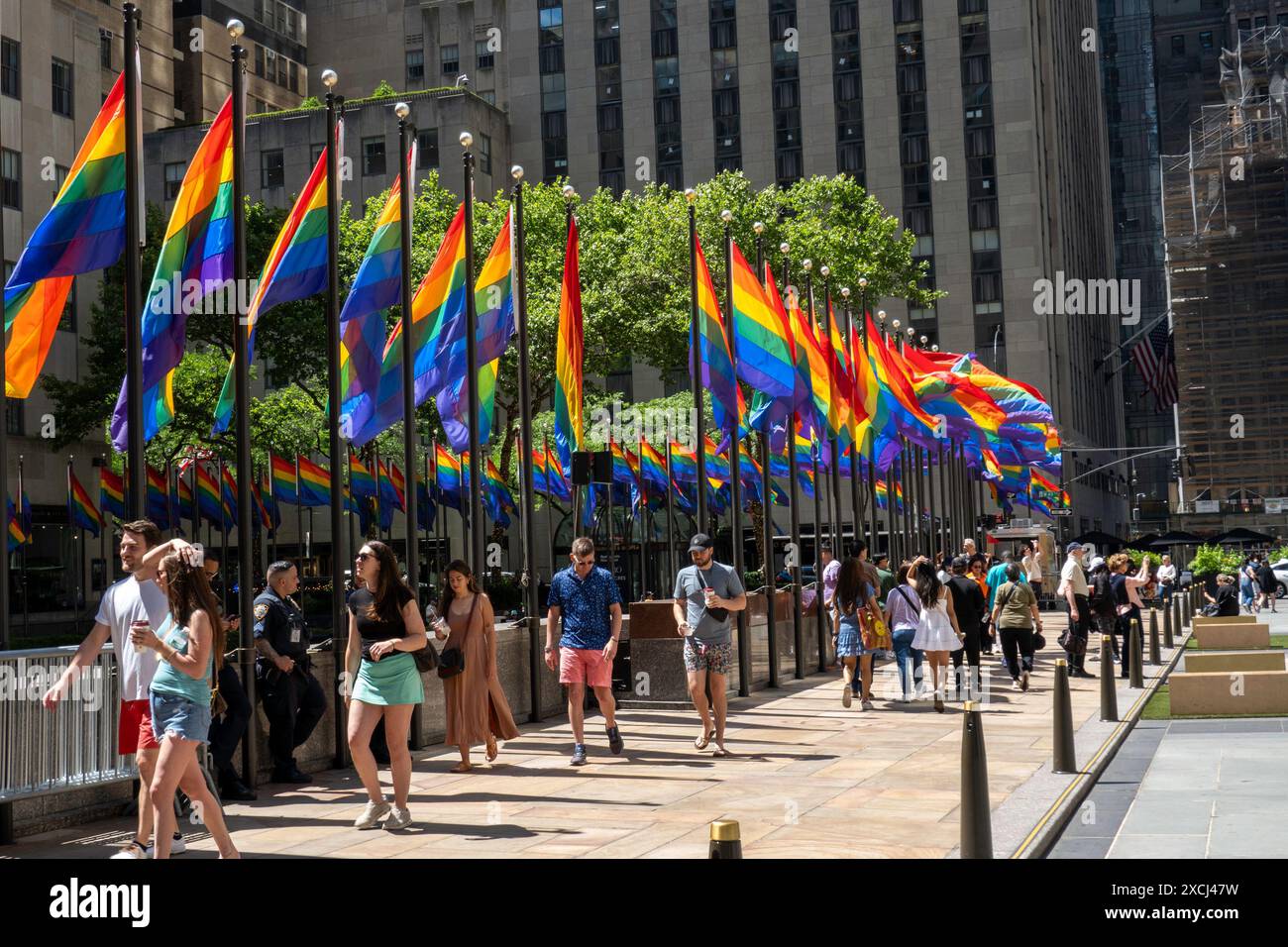 Pride month flags surround the plaza in Rockefeller Center, New York City, USA June 2024 Stock ...