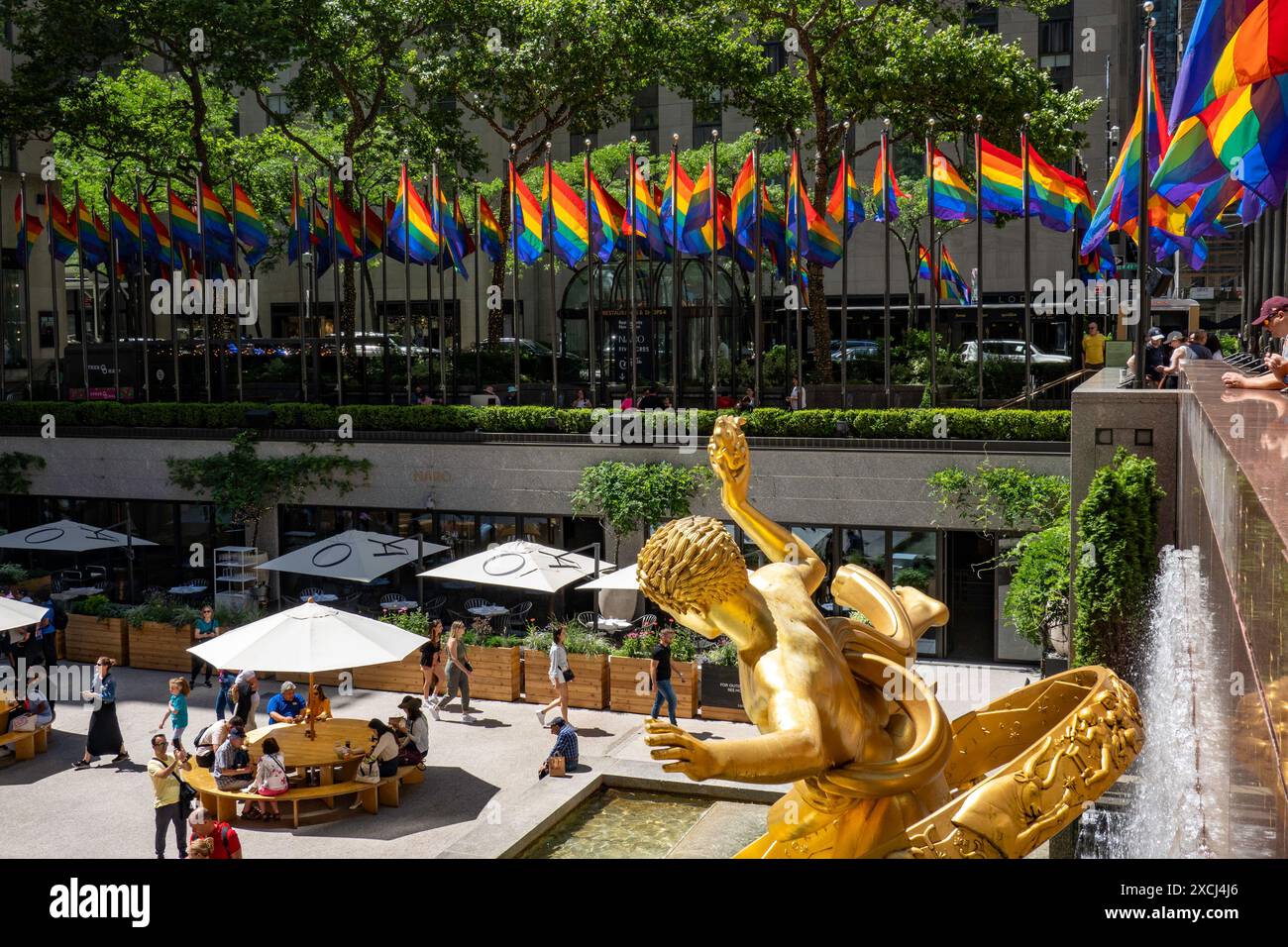 Pride month flags surround the plaza in Rockefeller Center, New York City, USA June 2024 Stock ...