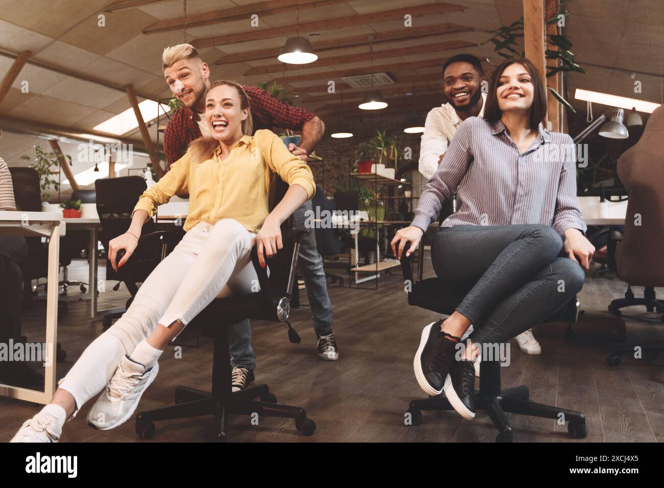 Work hard play hard. Business people having fun in office Stock Photo ...