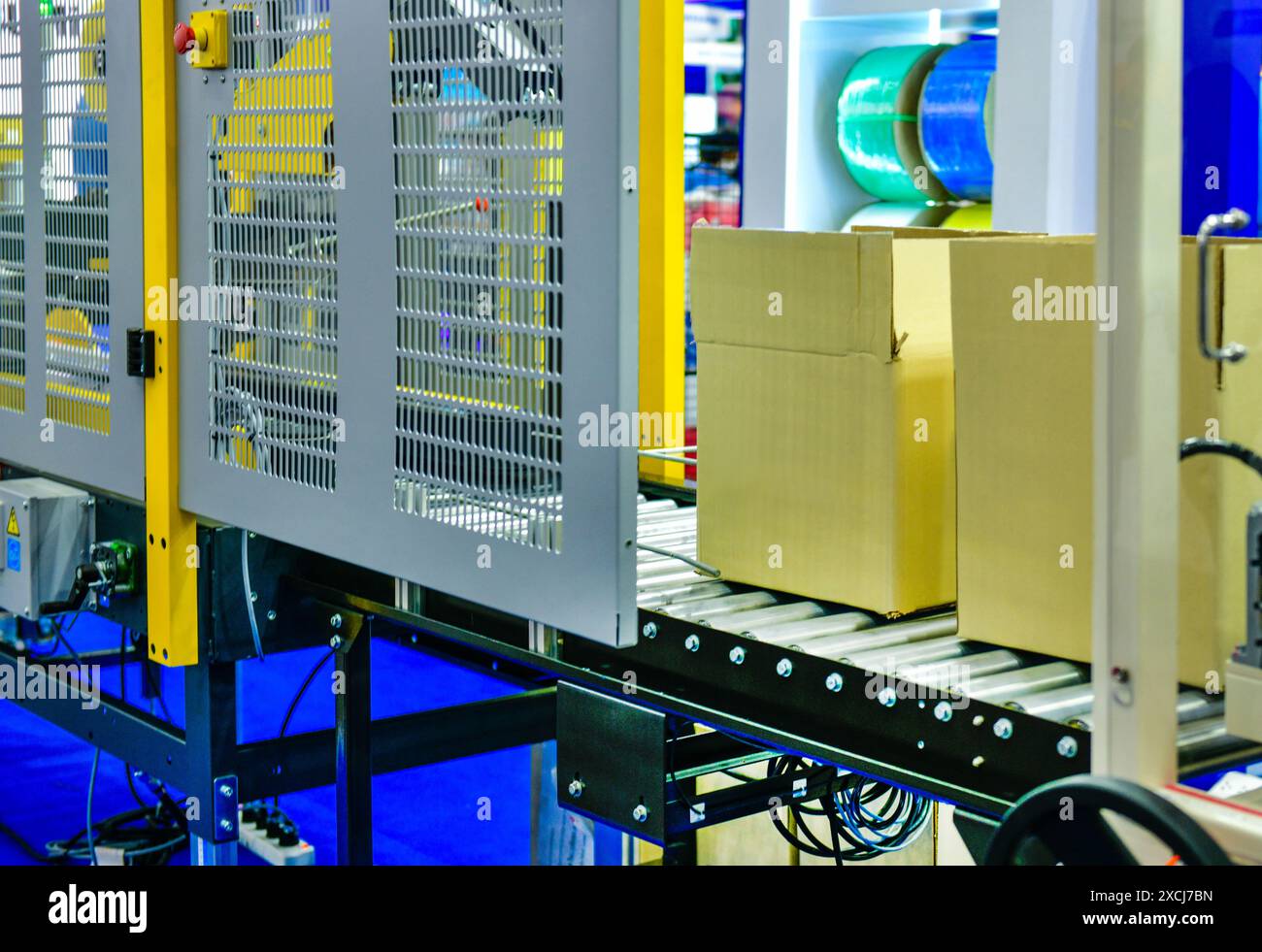 Cardboard boxes on a conveyor belt for packaging Parcel transportation ...