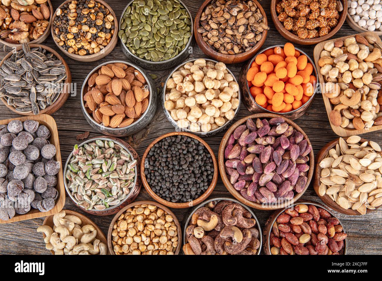 Assorted nuts and seeds background. mixed raw food for snacking, top ...
