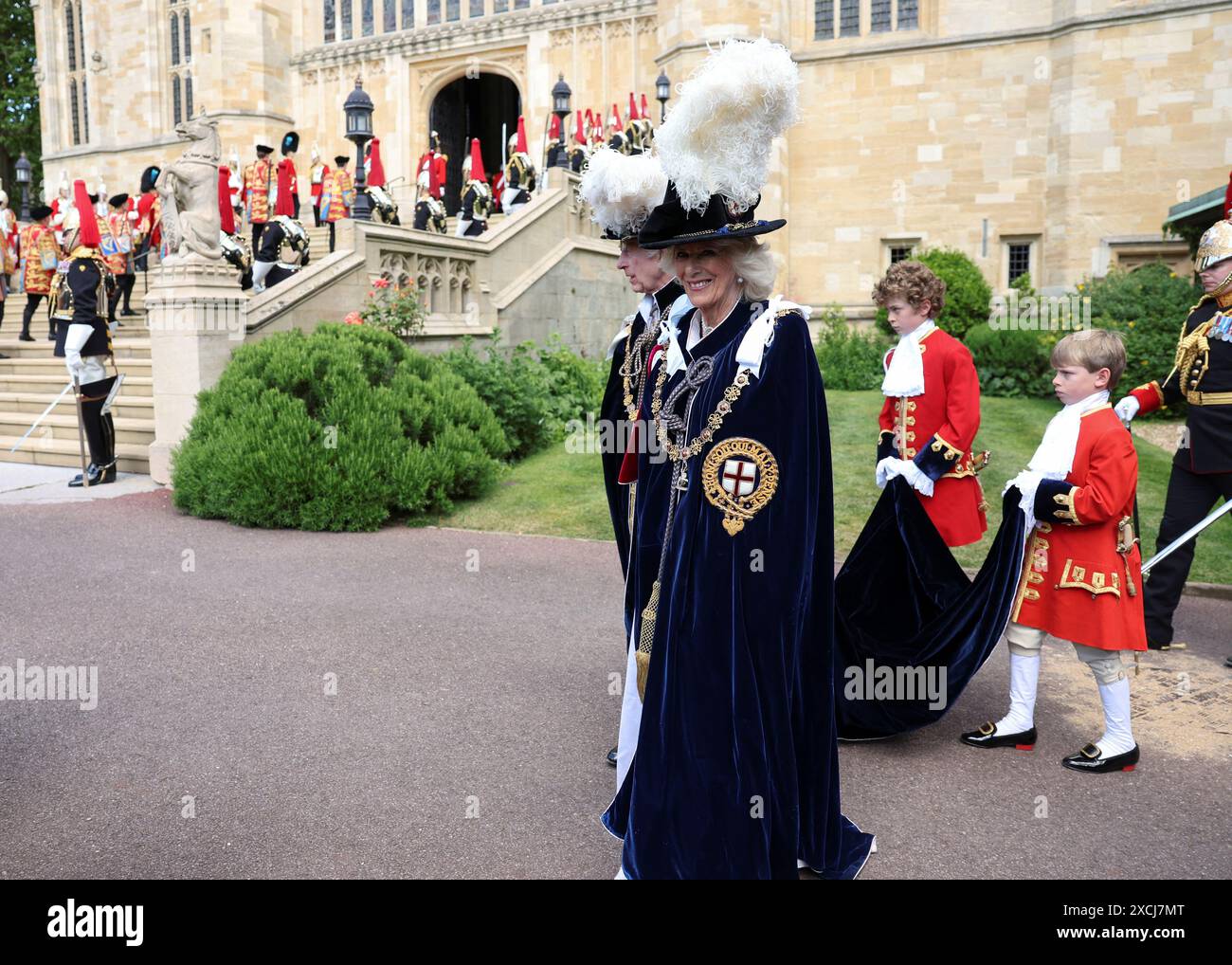 King Charles III and Queen Camilla are followed by Page of Honour ...