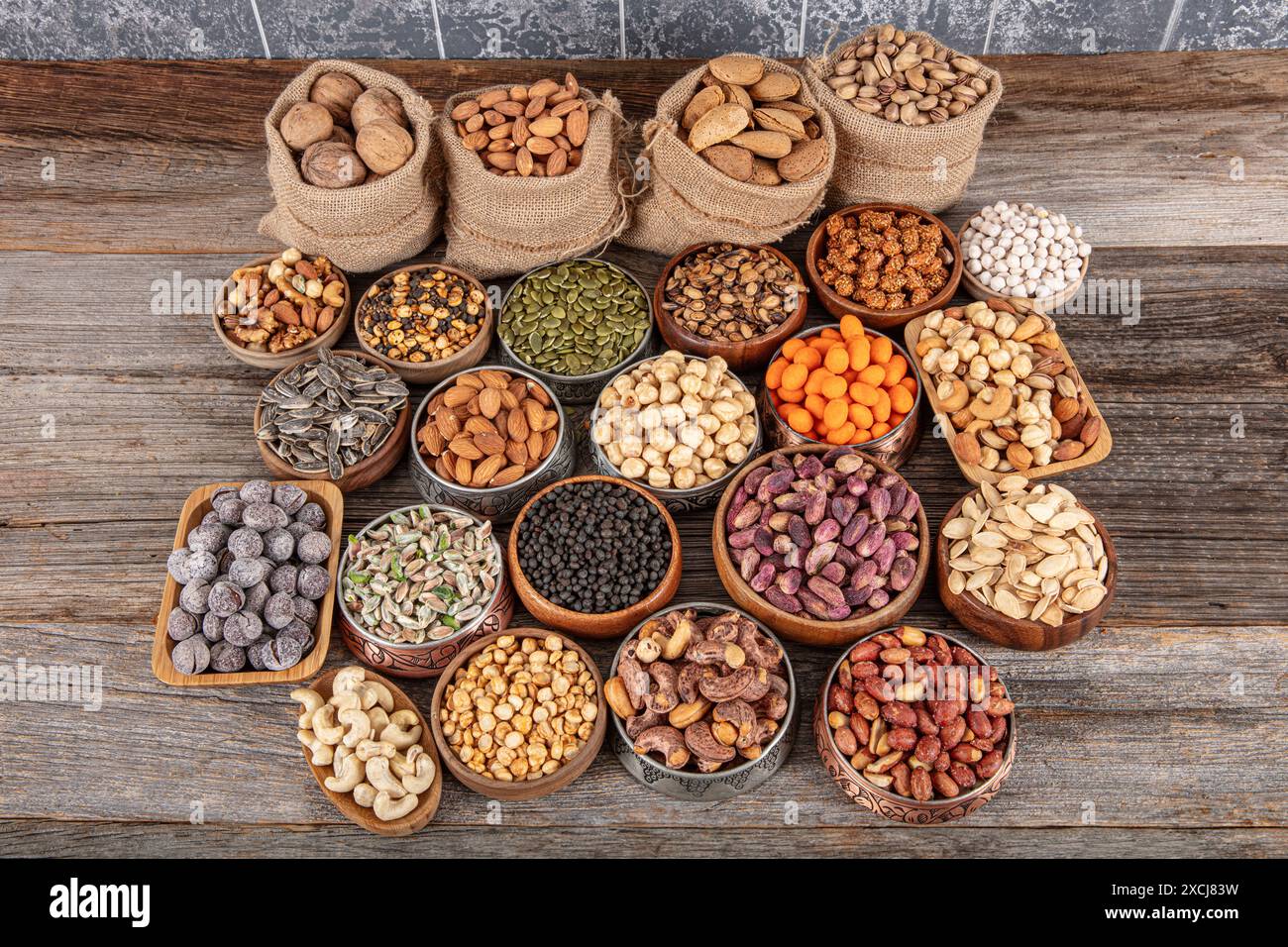 Assorted nuts and seeds background. mixed raw food for snacking, top ...