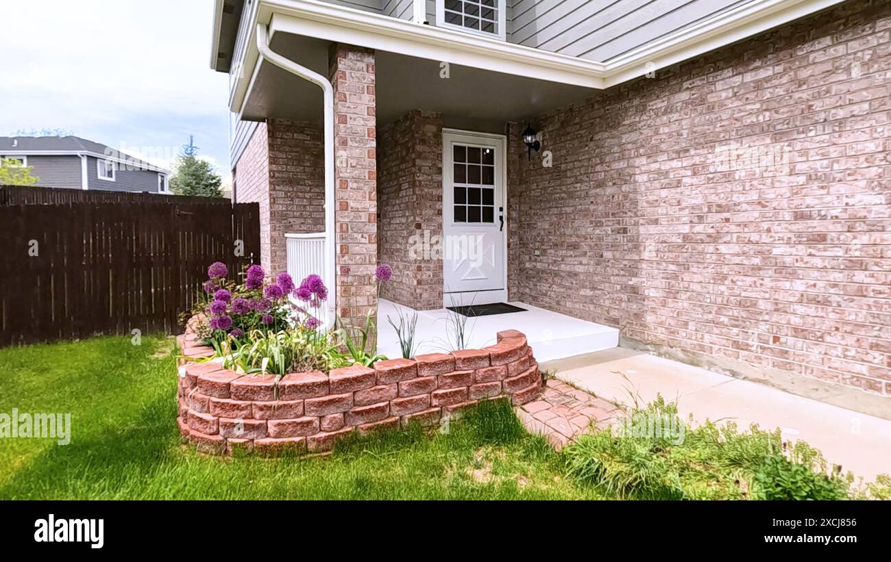 Charming Brick House Front Porch with Well-Maintained Garden Stock ...