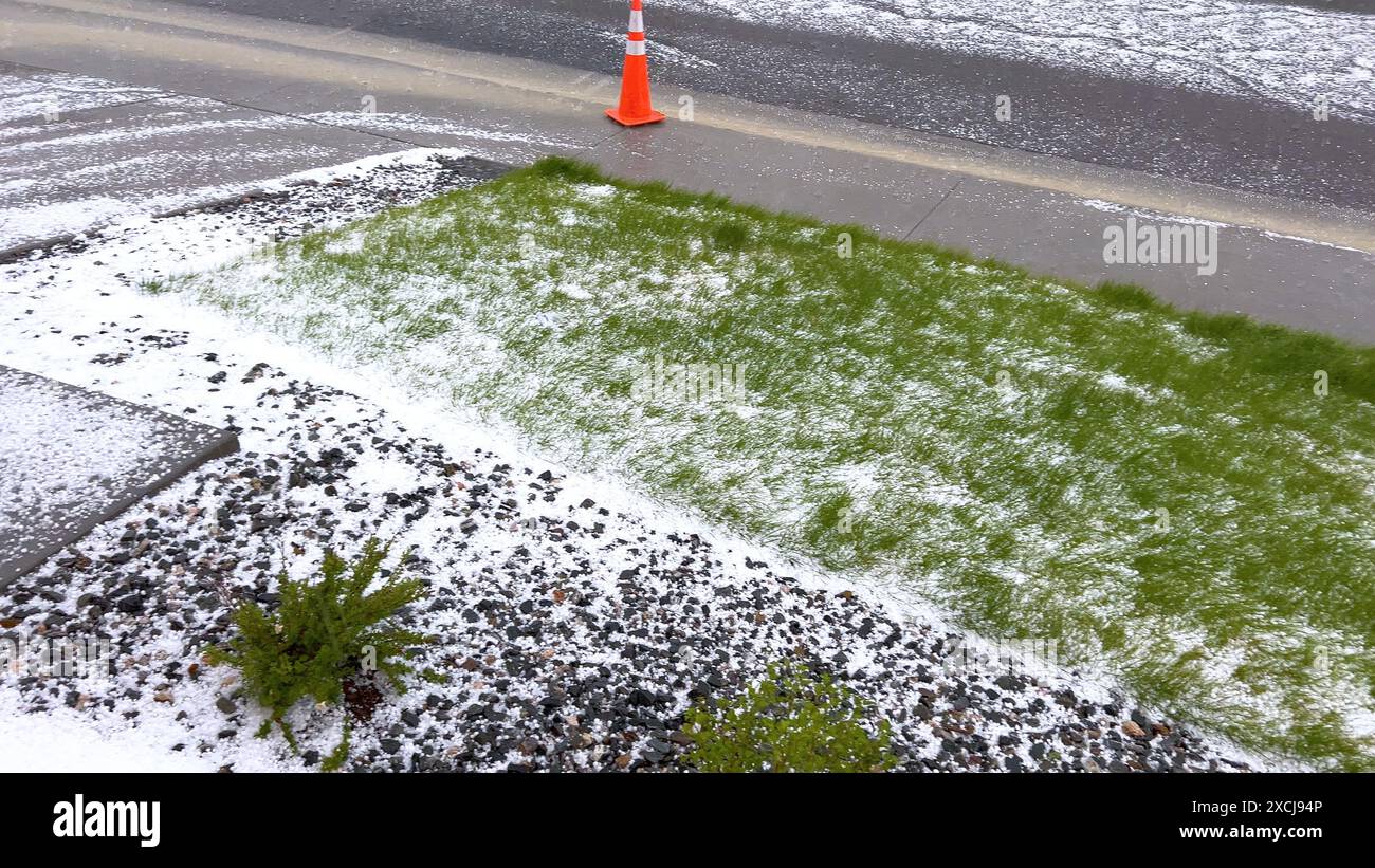 Lawn and Rock Garden Covered in Hail After Storm Stock Photo - Alamy