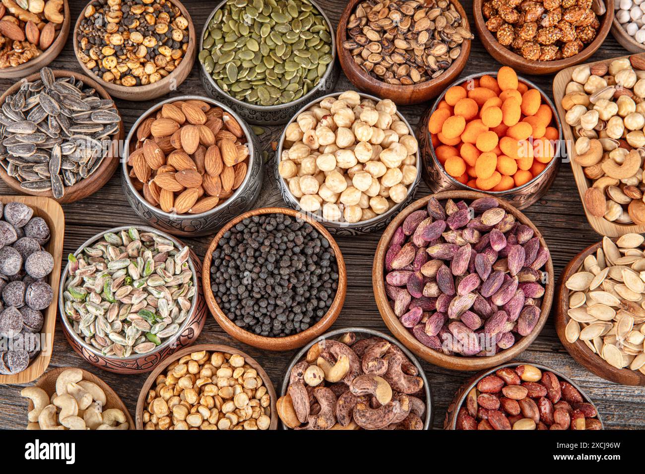 Assorted nuts and seeds background. mixed raw food for snacking, top ...