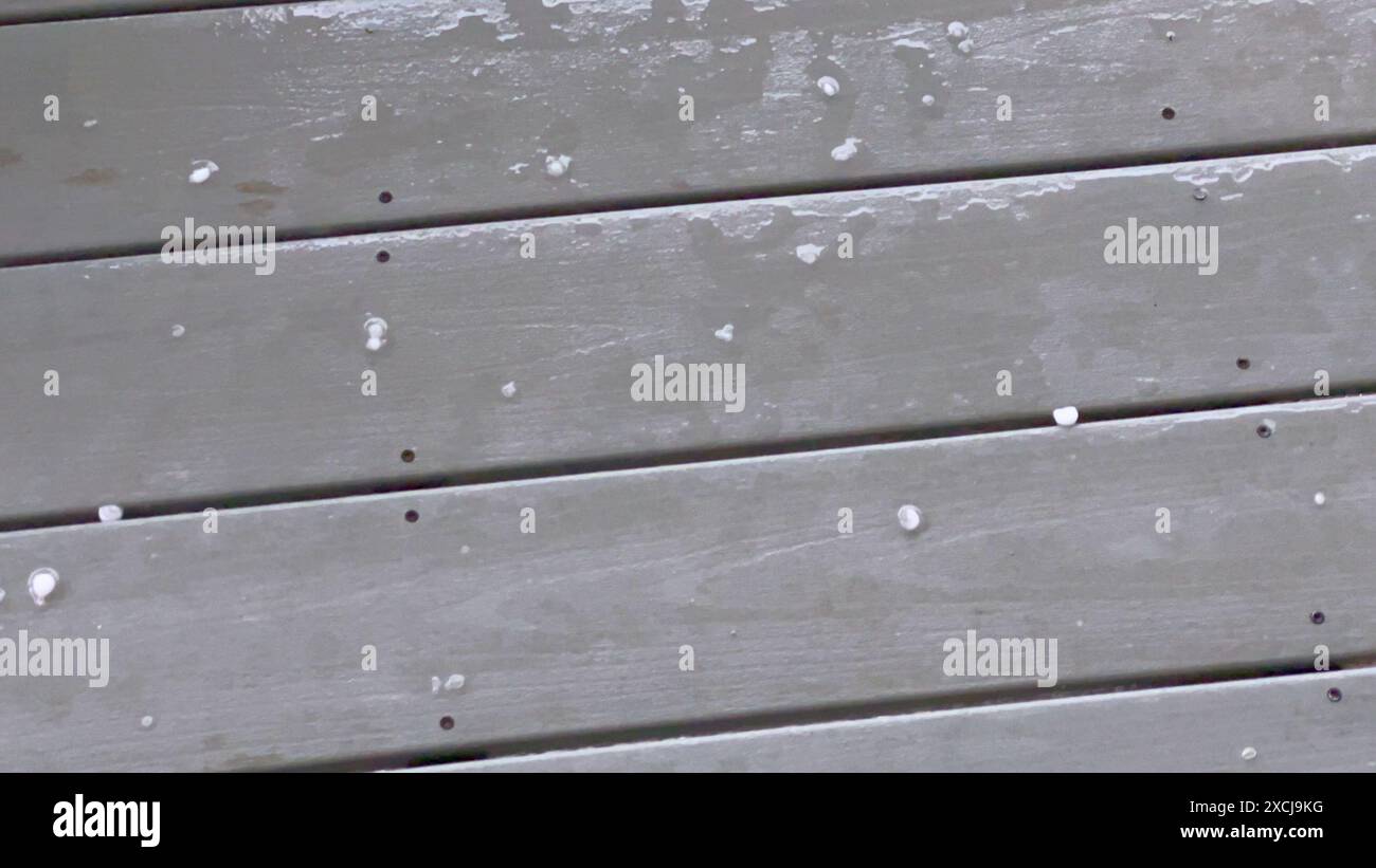 Hail Storm on Wooden Deck with Patio Furniture Stock Photo - Alamy