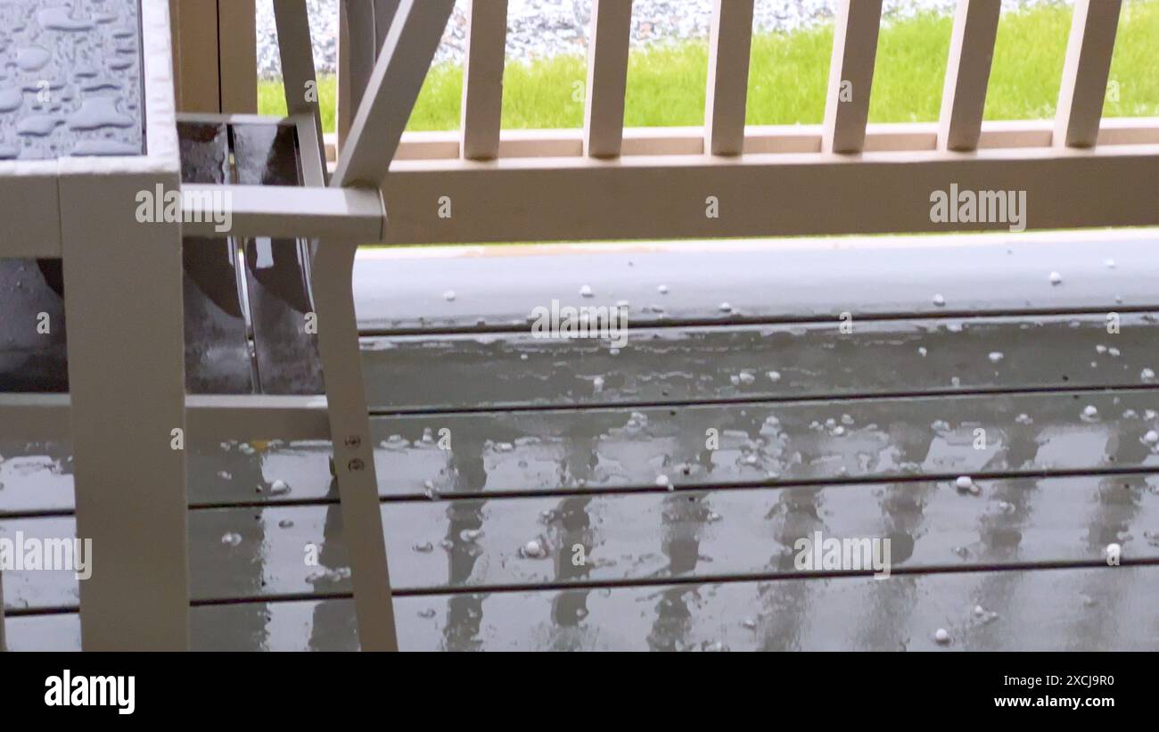 Hail Storm on Wooden Deck with Patio Furniture Stock Photo - Alamy