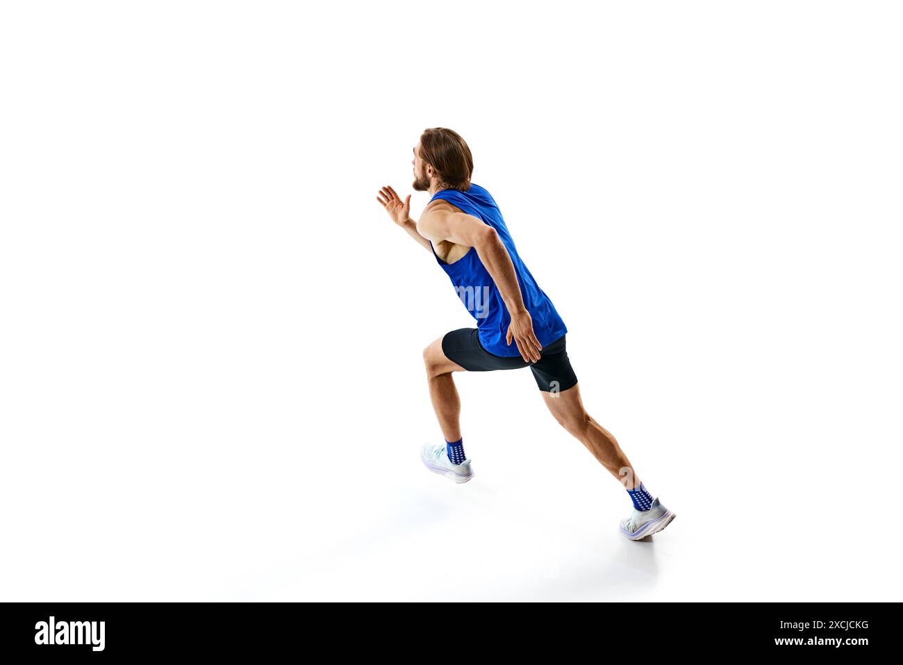 Young competitive man, runner athlete in motion, running,training ...