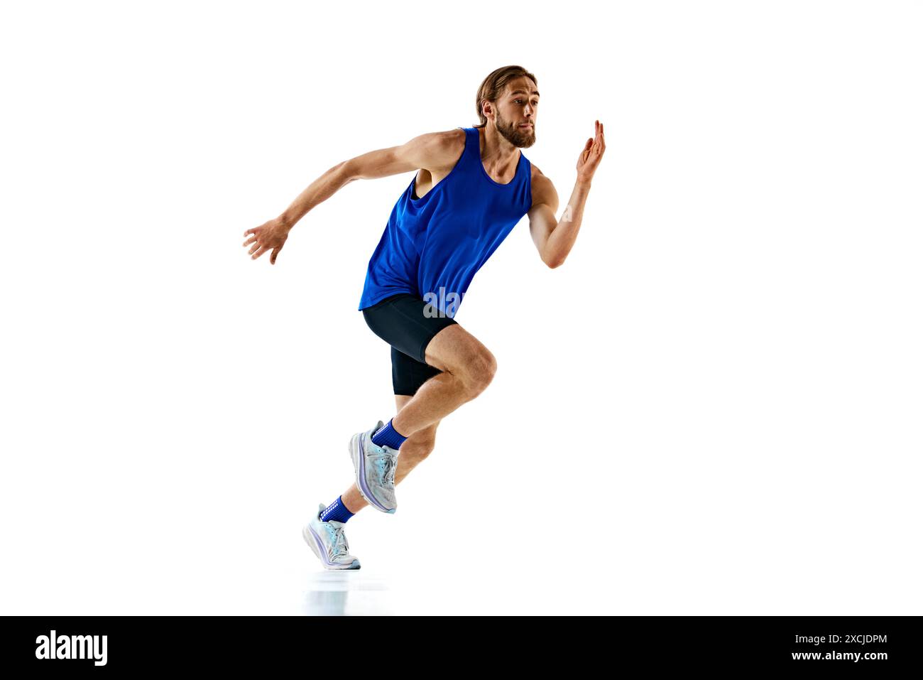 Focused and motivated young man, competitive athlete in motion, running ...