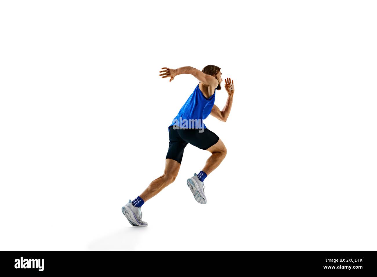 Dynamic image of man in a run, runner in motion, training isolated on ...