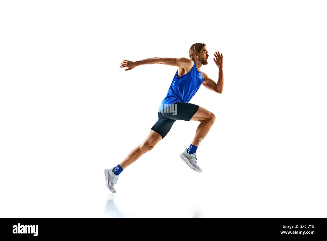 Dynamic image of man in a run, runner in motion, training isolated on ...
