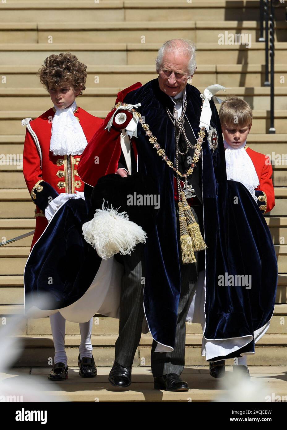 King Charles III is followed by Page of Honour Charles van Cutsem (left ...