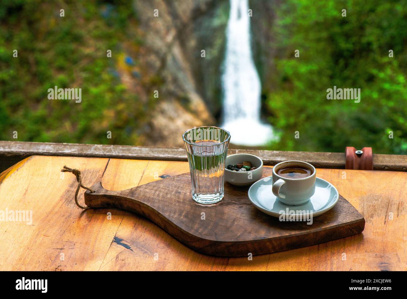 Turkish coffee presentation with pebble chocolate and a glass of water ...