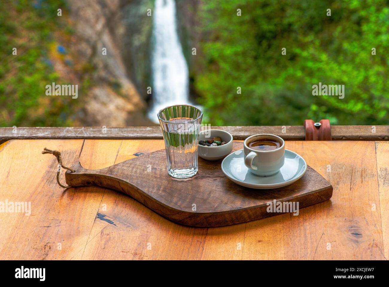 Turkish coffee presentation with pebble chocolate and a glass of water ...