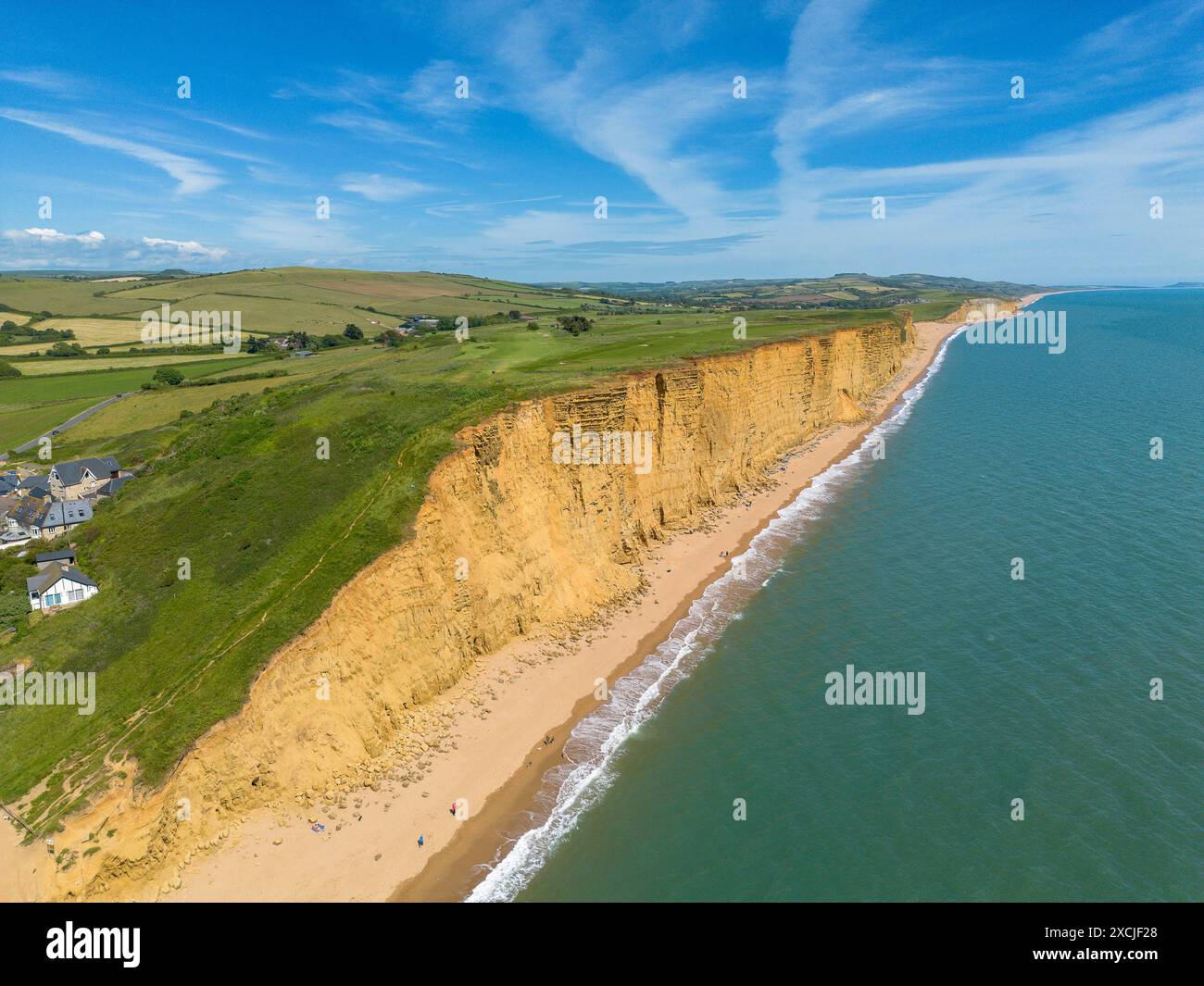West Bay, Dorset, UK. 17th June 2024. UK Weather. Aerial view of the beach and cliffs at the ...
