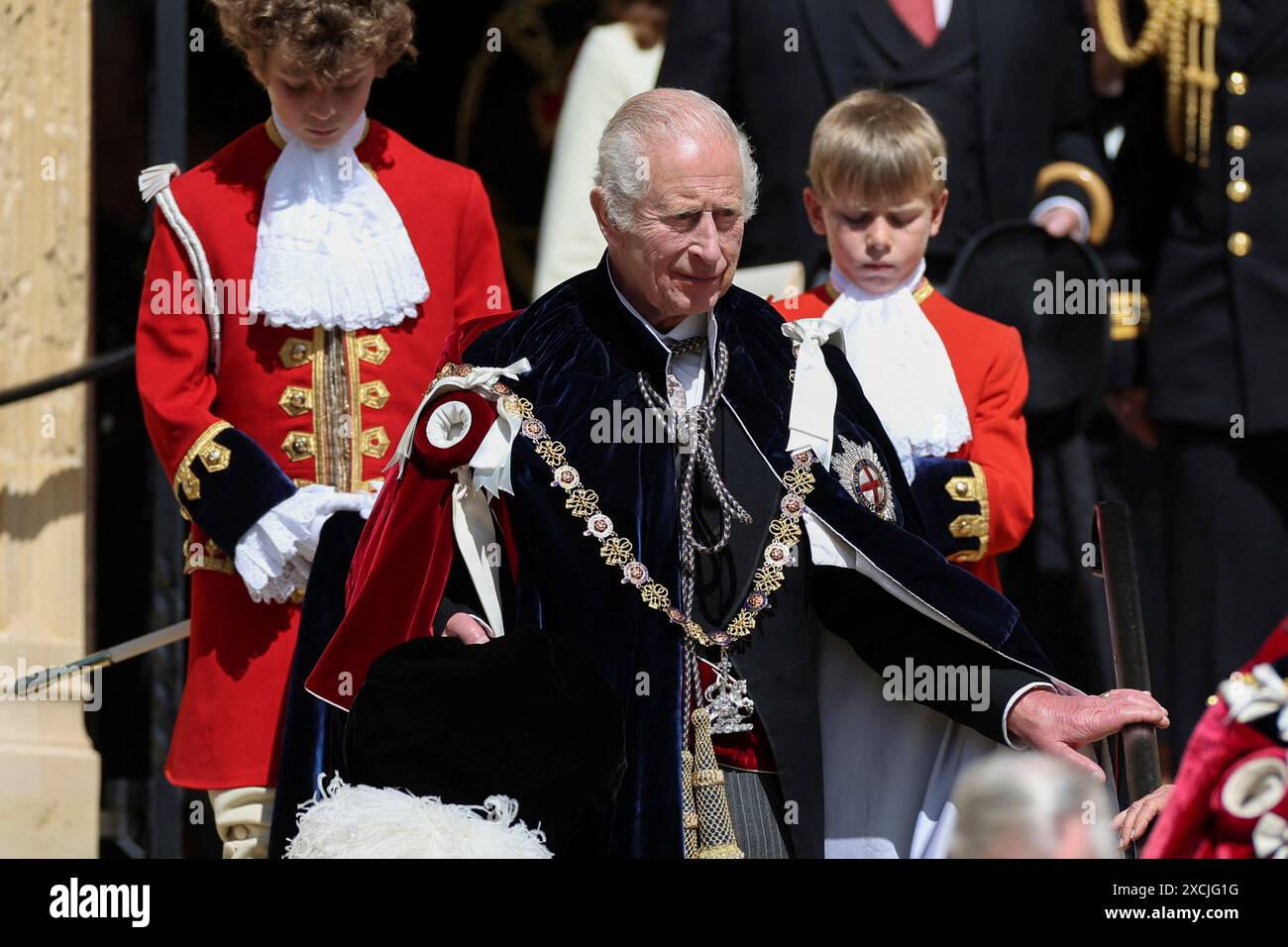 King Charles III is followed by Page of Honour Charles van Cutsem (left ...