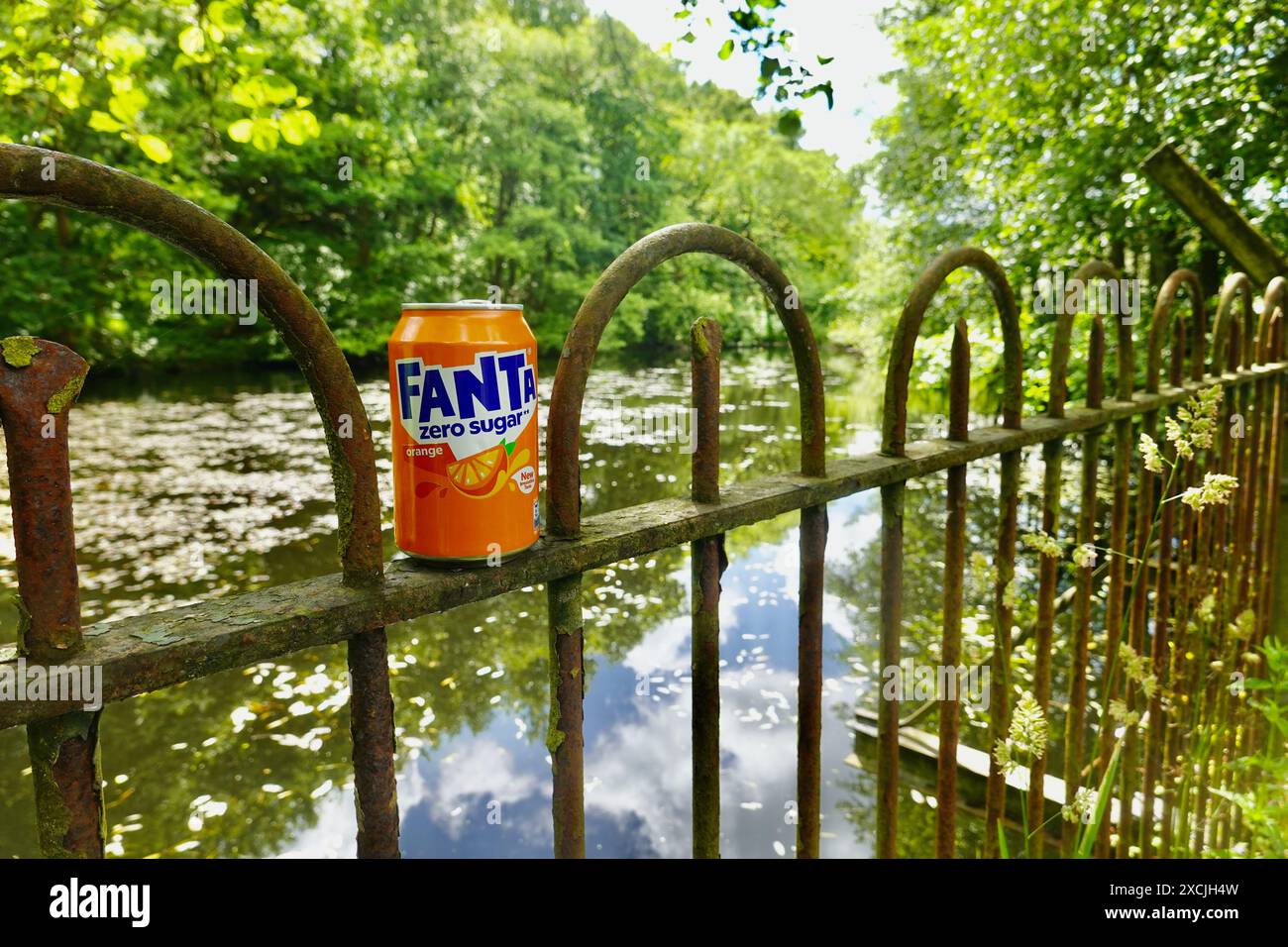Empty Fanta can left on railings Stock Photo - Alamy