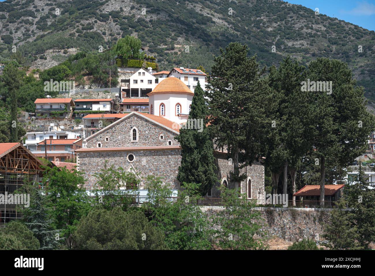 Traditional stone church building standing in front of mountain ...