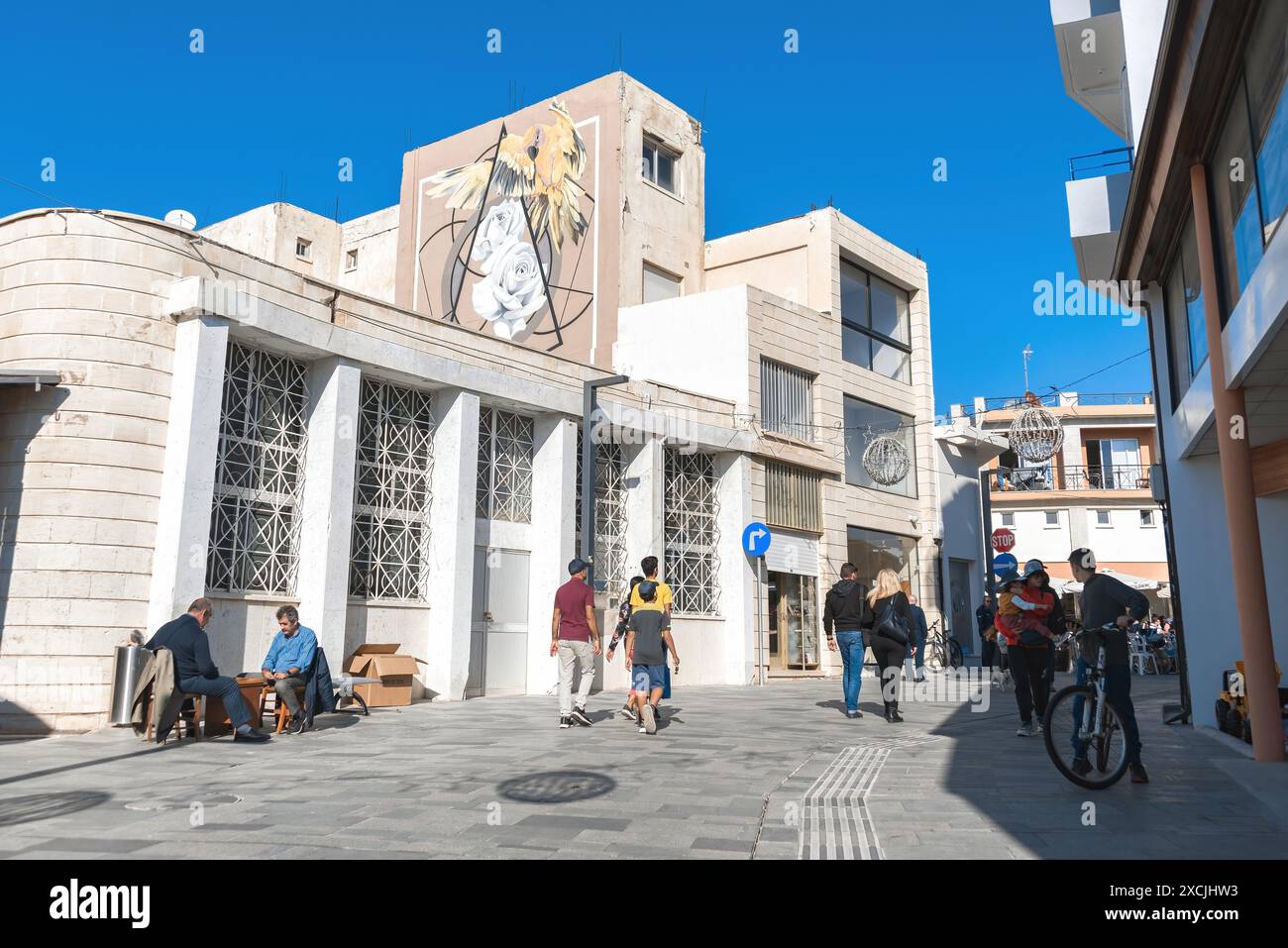 Paphos, Cyprus - October 21, 2019: Tourists and locals enjoying a sunny ...
