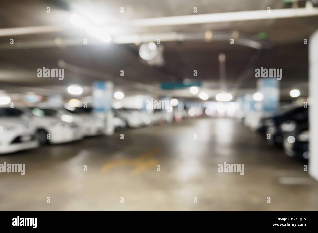 blur many cars in car parking lot inside shopping mall building Stock ...