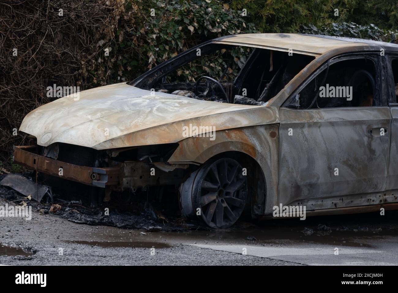 Burnt Car Wreck on Roadside Stock Photo - Alamy
