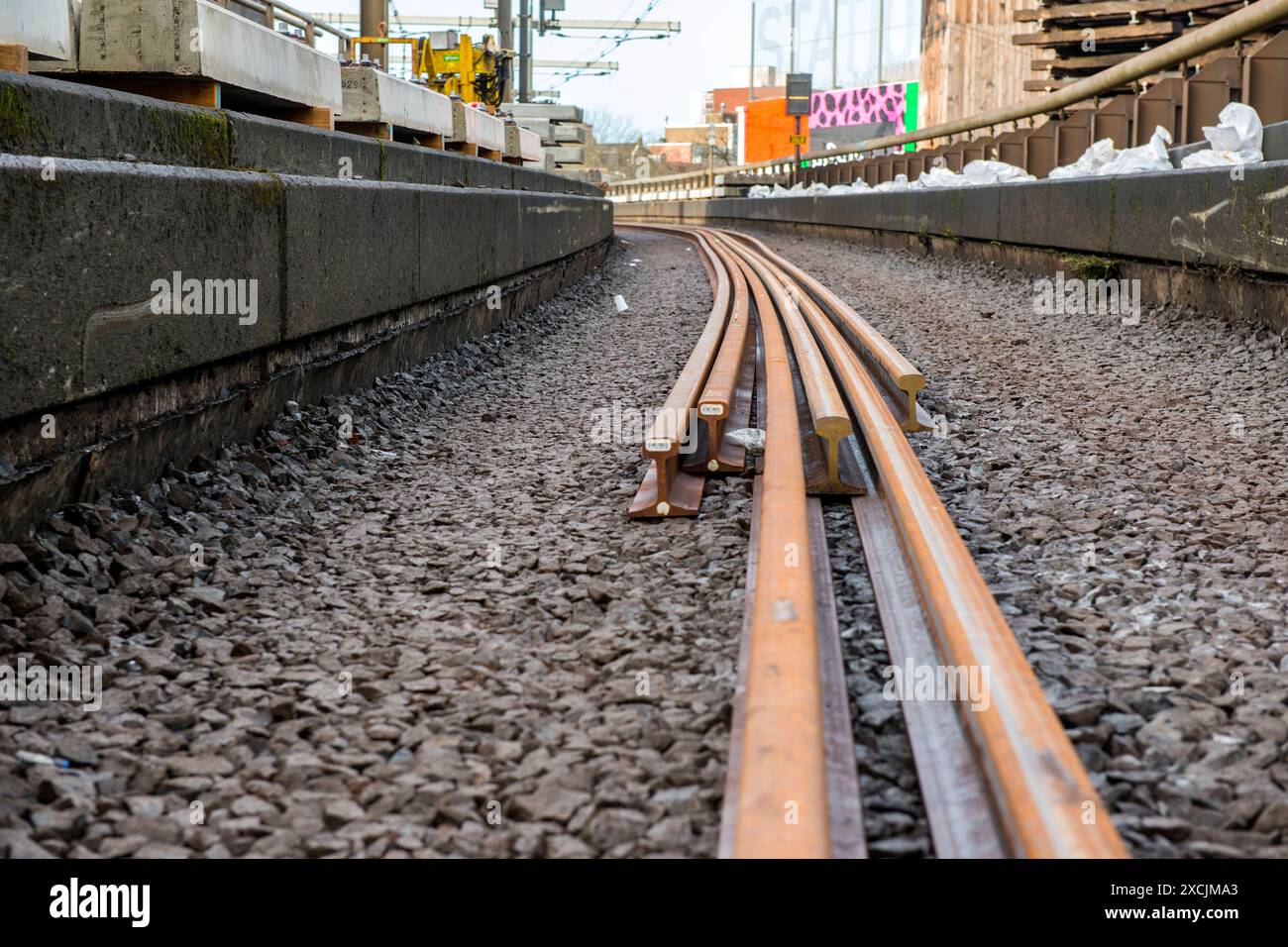 New Rails on Track Rotterdam, Netherlands. New railroad track beams waiting to be installed in ...