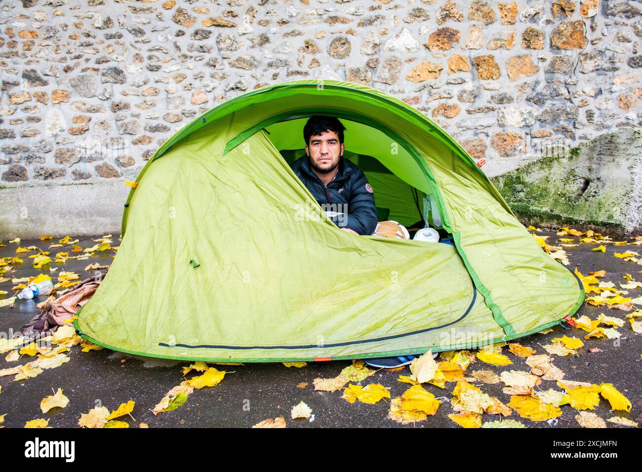 Refugee Migrant inside his Tent Refugee Migrant living inside his tent ...