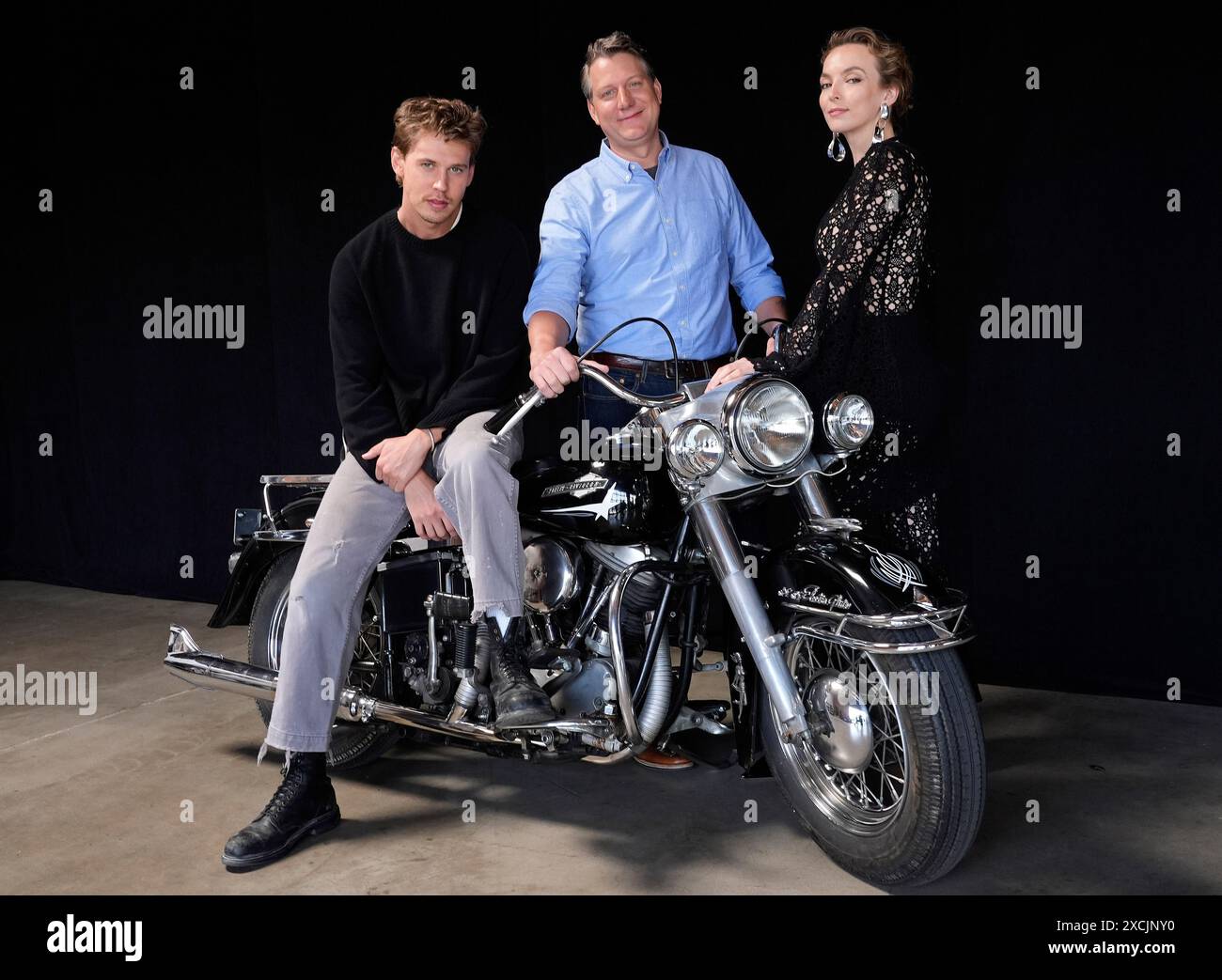 Jeff Nichols, center, writer/director of "The Bikeriders," poses with cast members Austin Butler ...