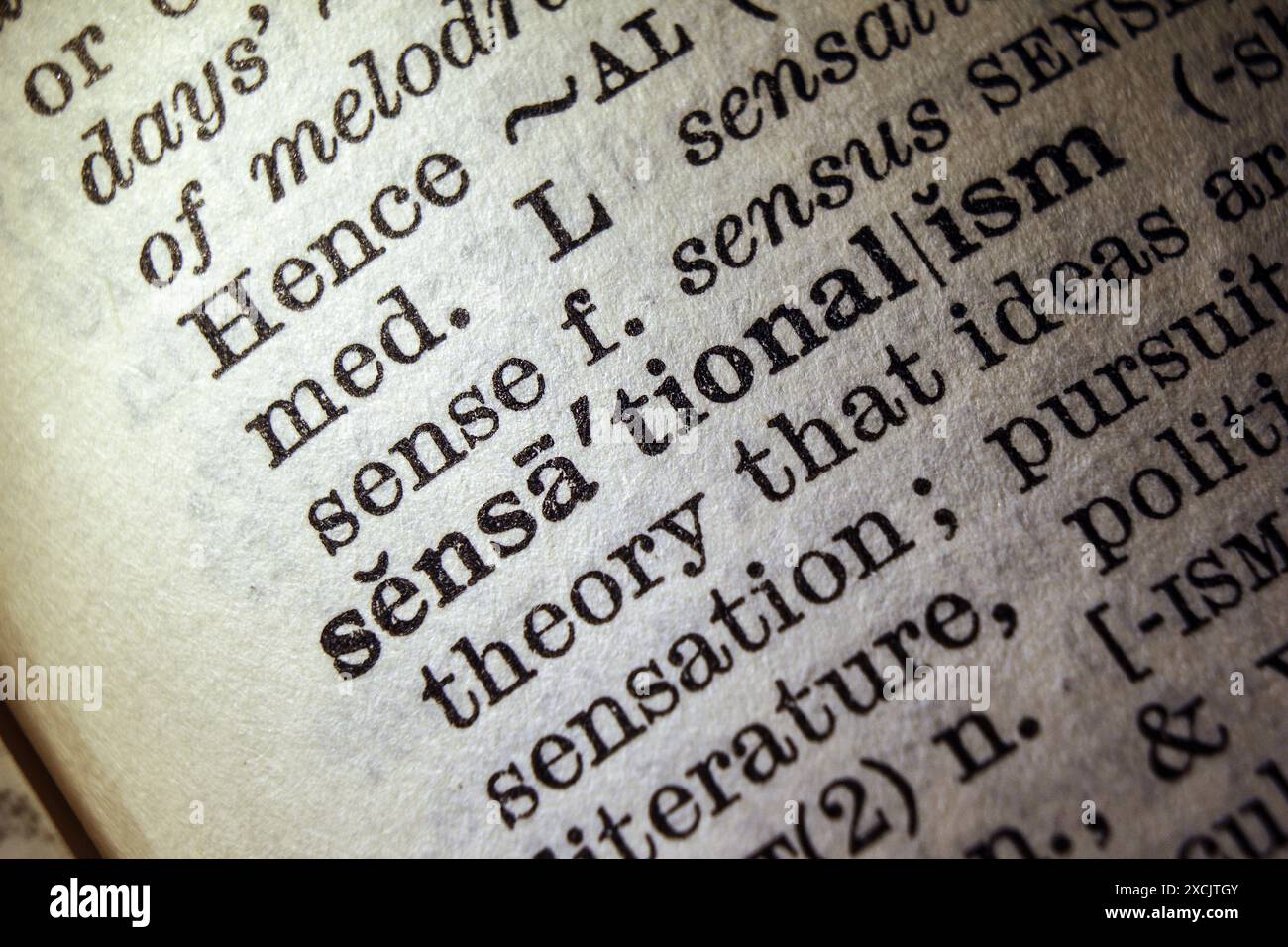 Word sensationalism on dictionary page, macro close-up Stock Photo - Alamy