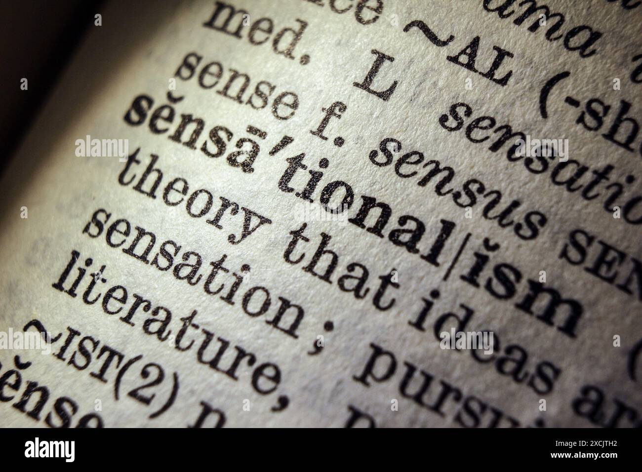 Word sensationalism on dictionary page, macro close-up Stock Photo - Alamy