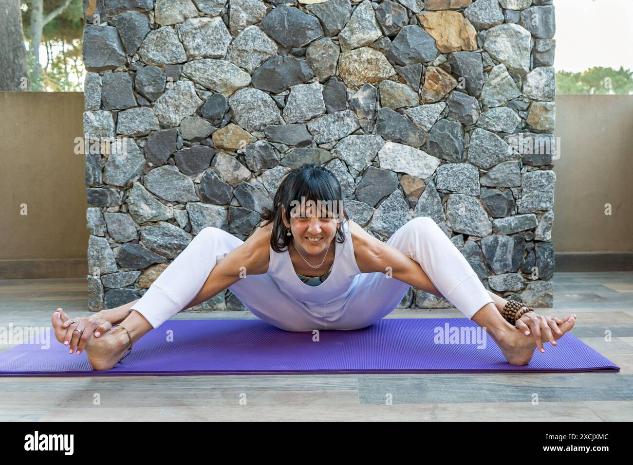 Slim woman practicing yoga poses hi-res stock photography and images ...