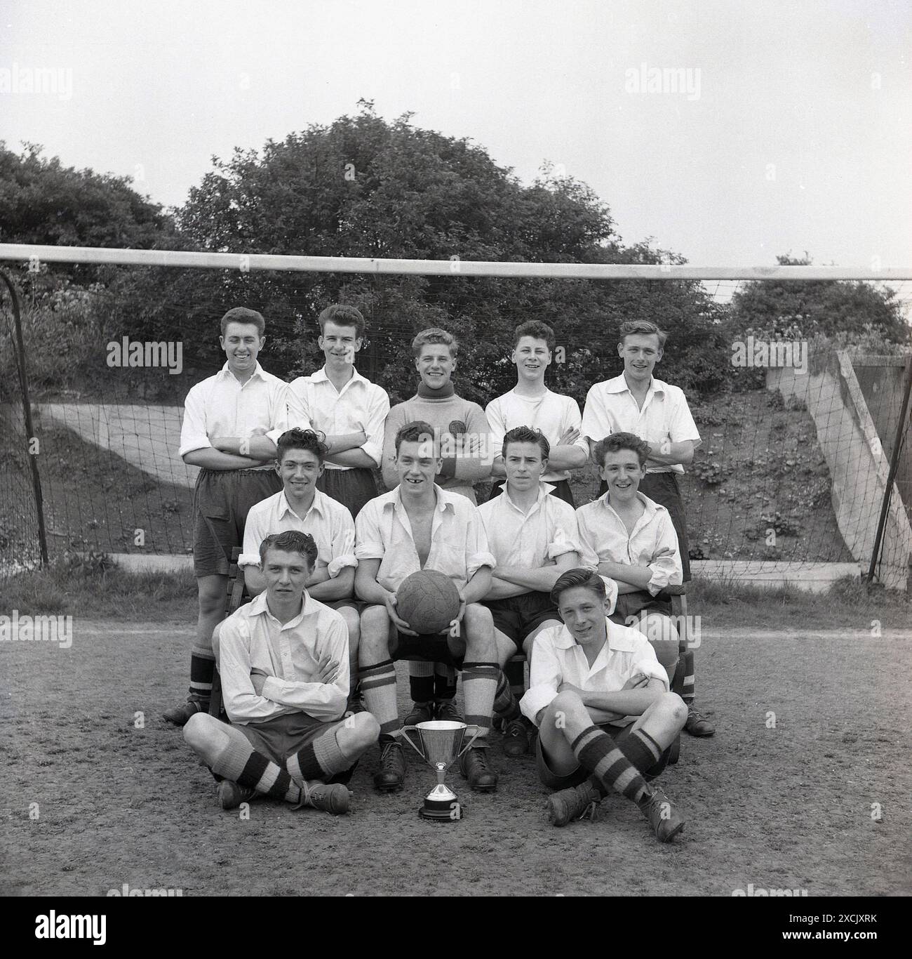 1950s, historical, fresh faced young men sitting for a group picture ...