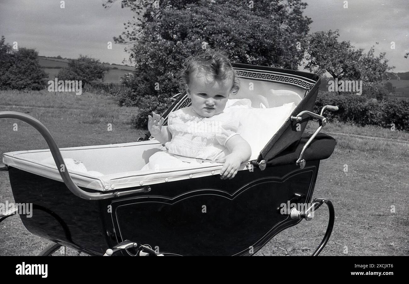 1960s, historical, infant child sitting in coach pram Stock Photo - Alamy