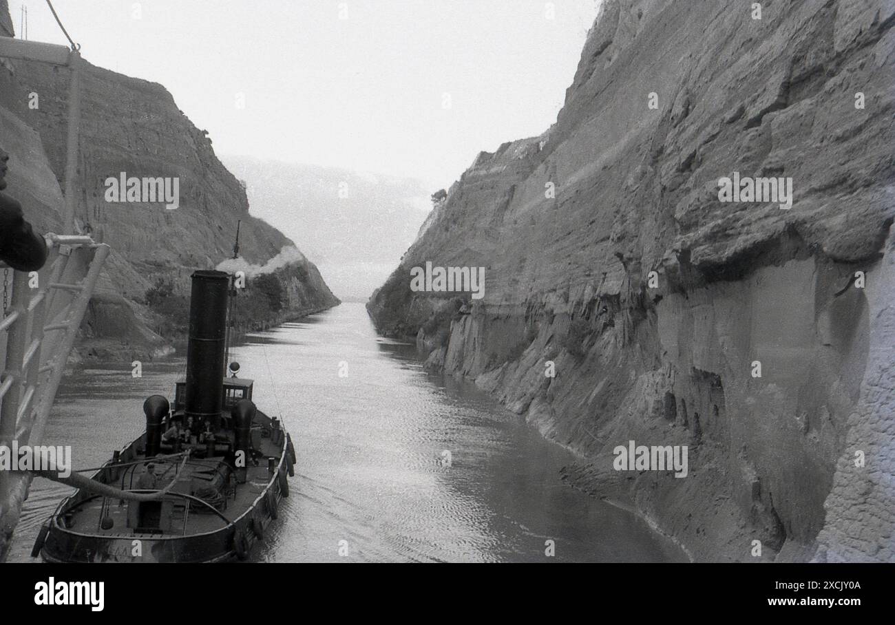 1950s, historical, narrow channel near Gibraltar, tug boat pulling ...