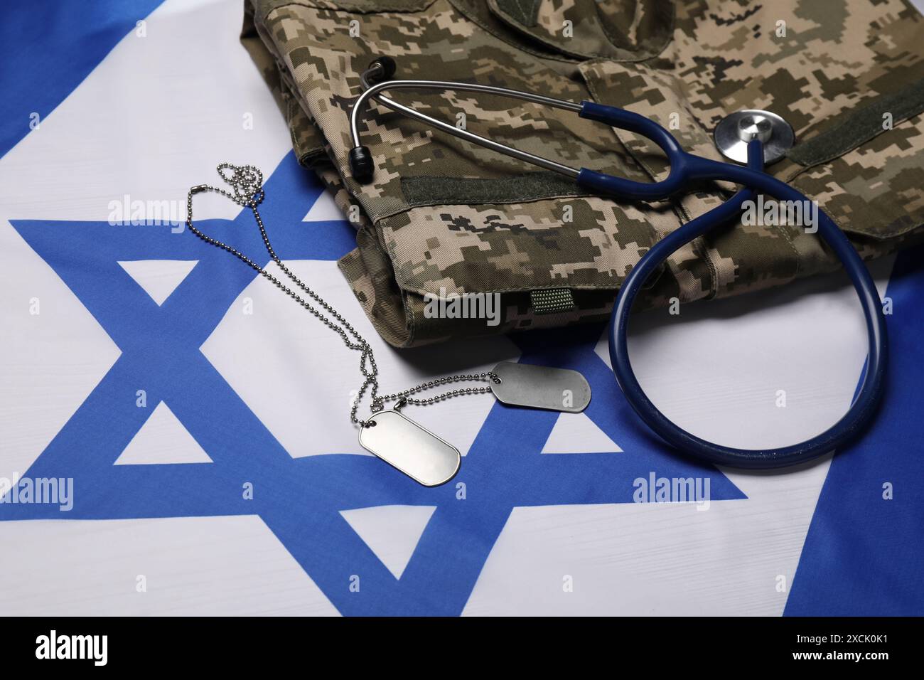 Stethoscope, tags and military uniform on flag of Israel Stock Photo ...