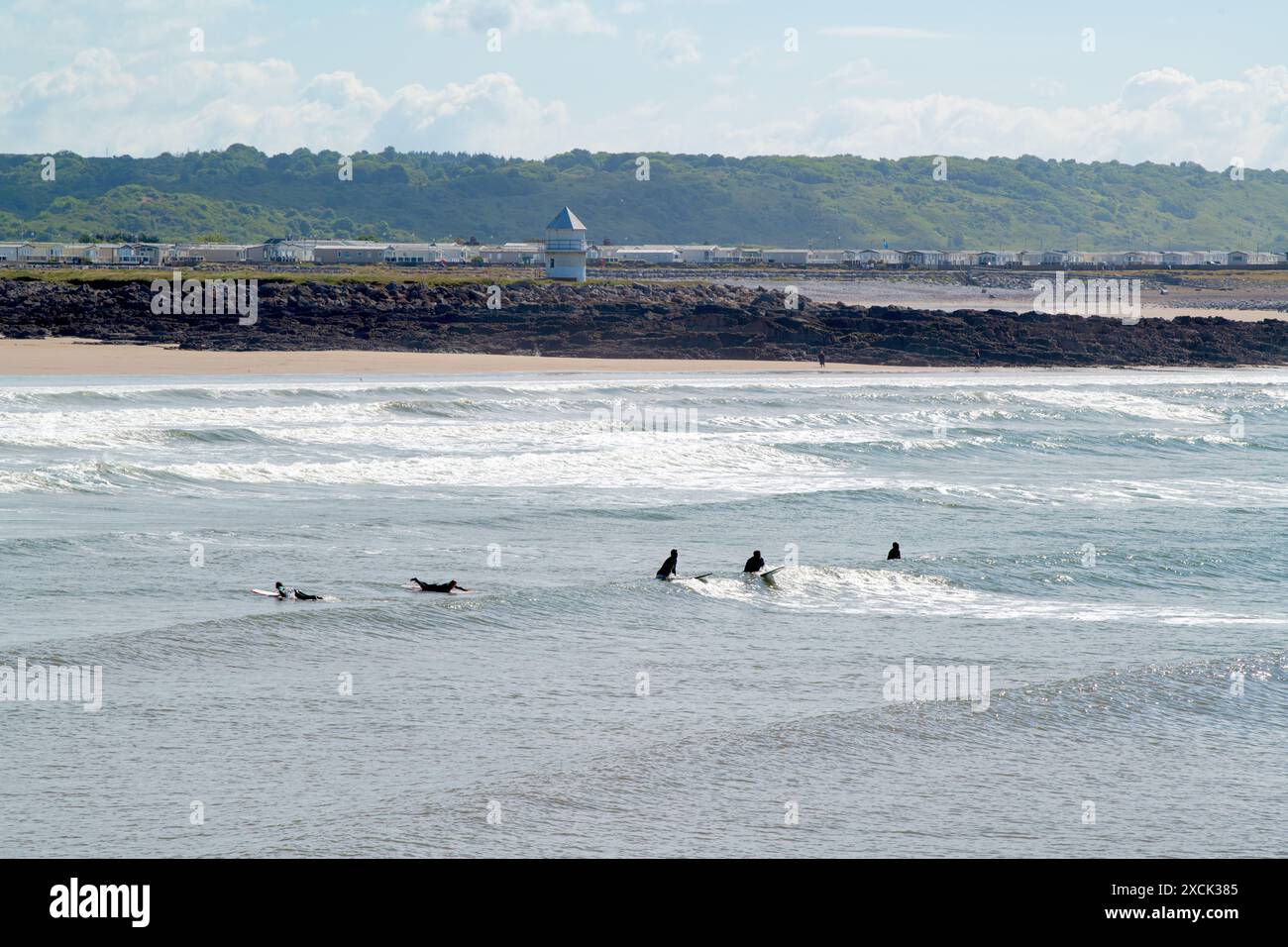 Surfers at Coney Beach, with Trecco Bay, the coastguard tower and ...