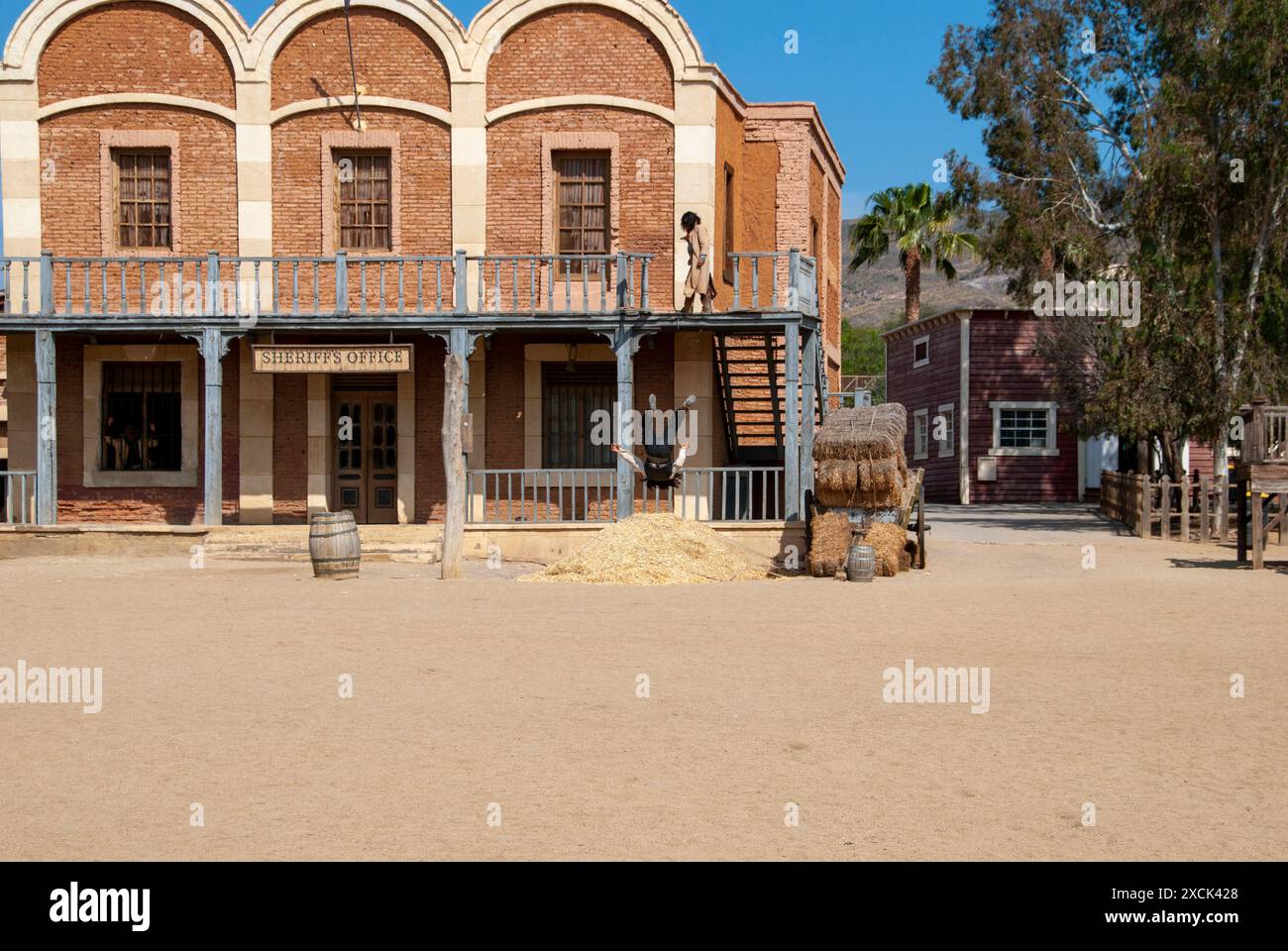 Two cowboys fighting on a Wild west Film Set Stock Photo - Alamy