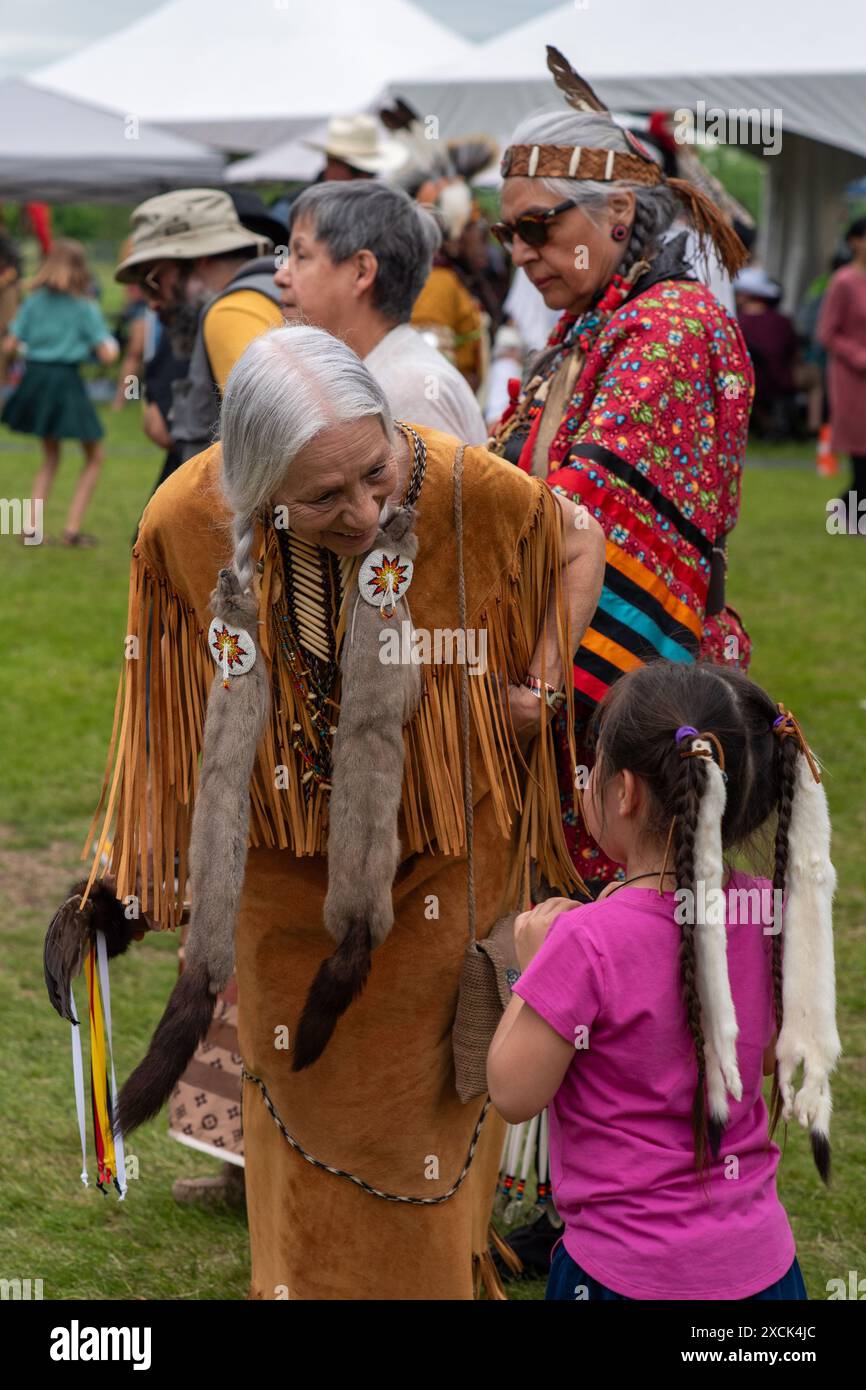 Senior Indigenous woman talking to cute little girl Stock Photo - Alamy